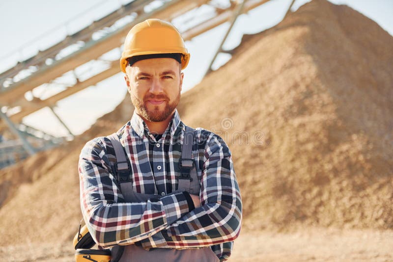 Positive Man. Construction Worker in Uniform is on the Quarry Stock ...