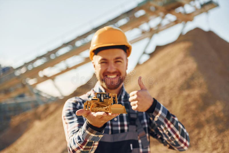 Positive Man. Construction Worker in Uniform is on the Quarry Stock ...