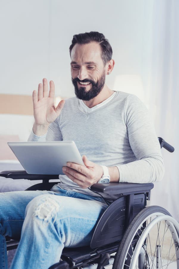 Positive Man with Disability Smiling while Having a Video Call Stock ...