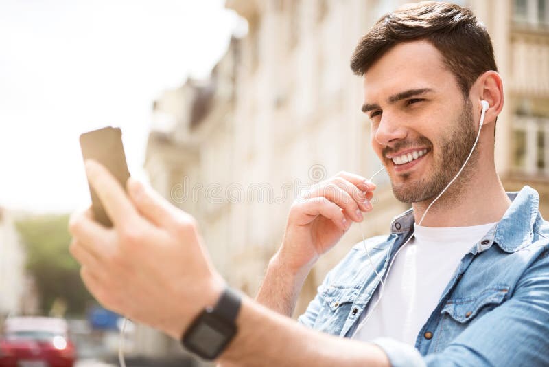 Positive Man Holding Cell Phone Stock Photo - Image of emotion ...