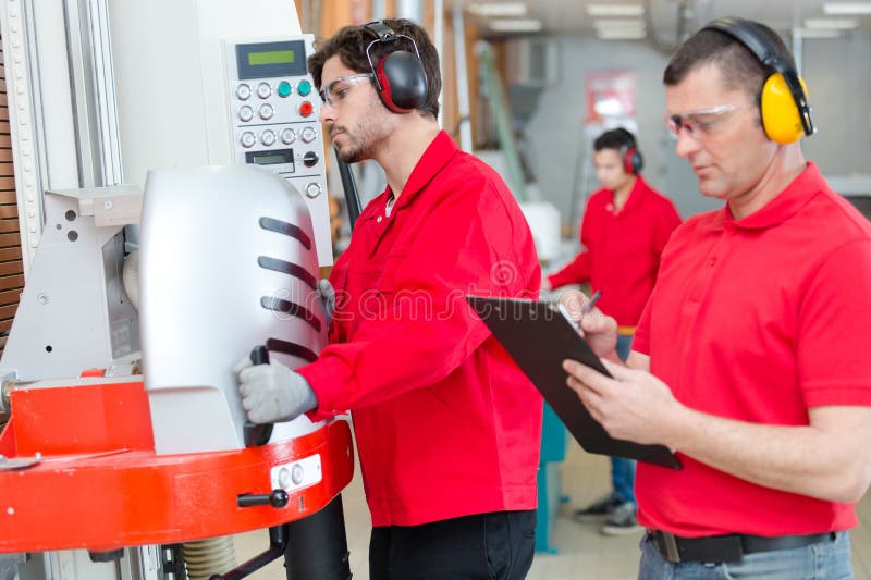 Positive Mature Labour Working on Lathe Machine at Factory Stock Image ...