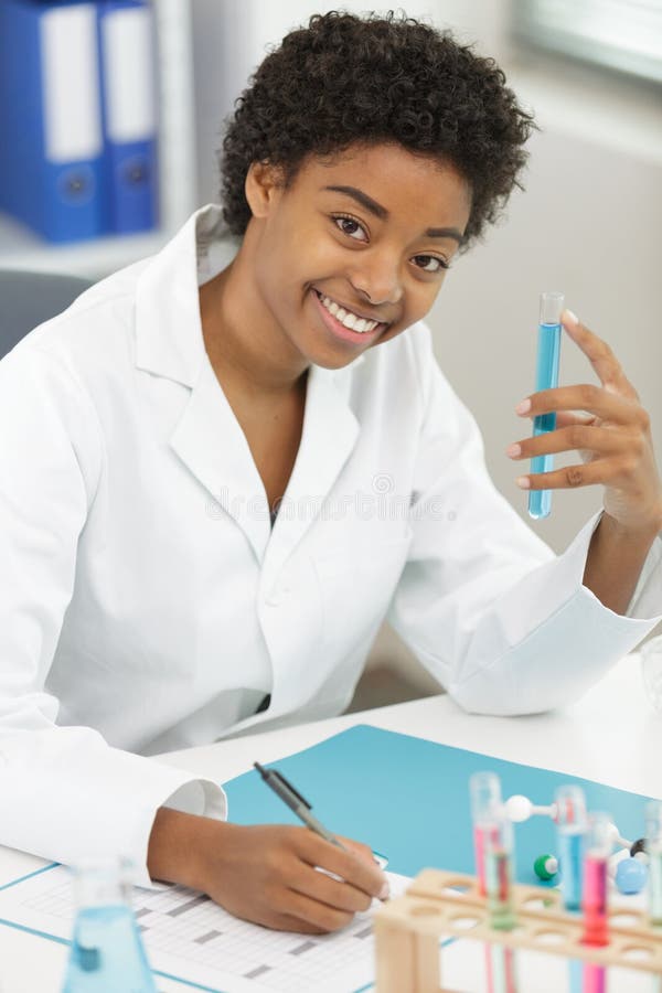 Positive Minded Woman Smiling while Looking at Test Tube Stock Photo ...