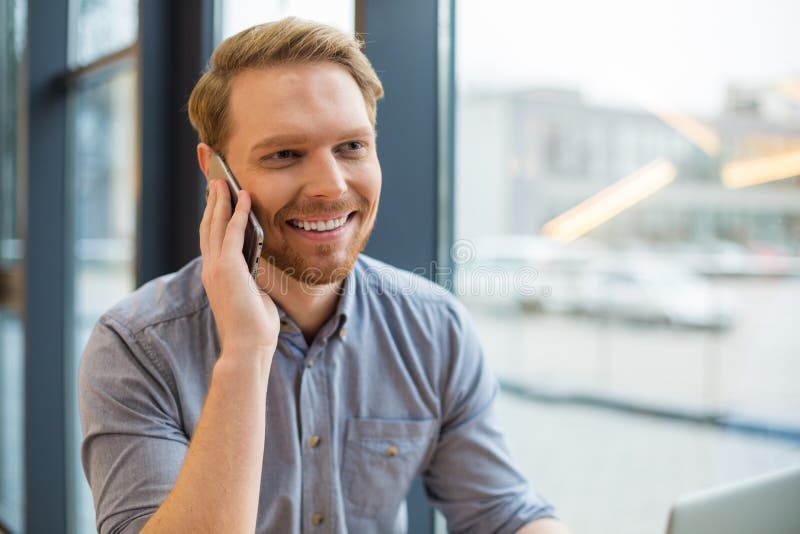 Positive Nice Man Having a Phone Conversation Stock Image - Image of ...