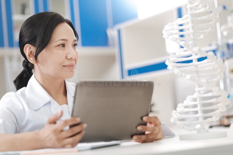 Positive Nice Scientist Studying Genome Stock Photo - Image of molecule ...