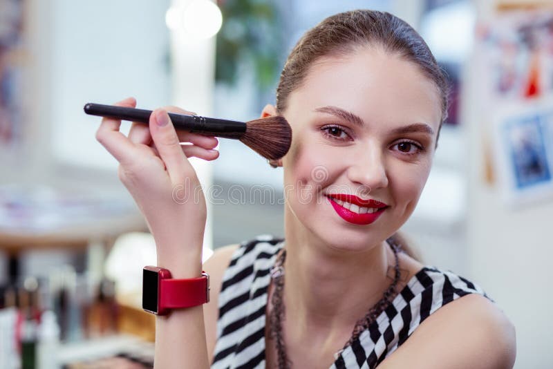 Positive Nice Woman Using Her Makeup Brush Stock Photo - Image of ...