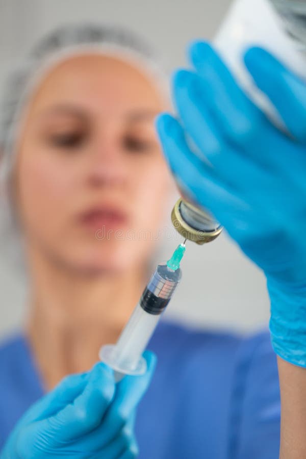 Positive Nurse Taking Injection with Syringe Stock Photo - Image of ...