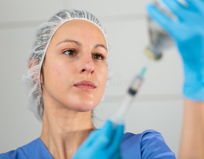 Positive Nurse Taking Injection with Syringe Stock Photo - Image of ...