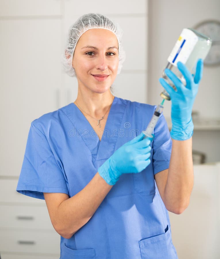 Positive Nurse Taking Injection with Syringe Stock Photo - Image of ...