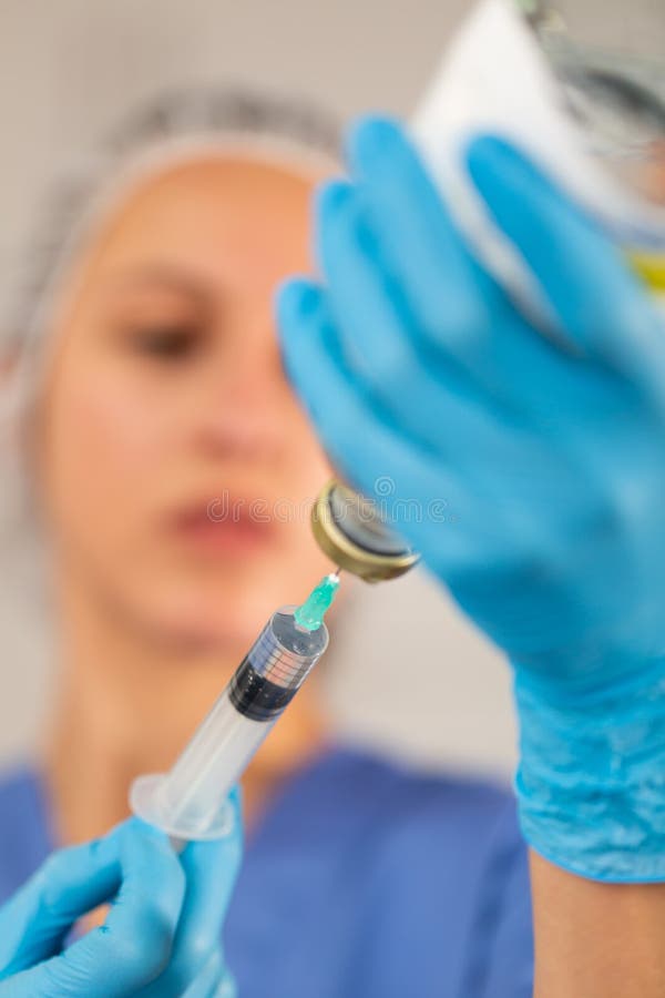 Positive Nurse Taking Injection with Syringe Stock Photo - Image of ...