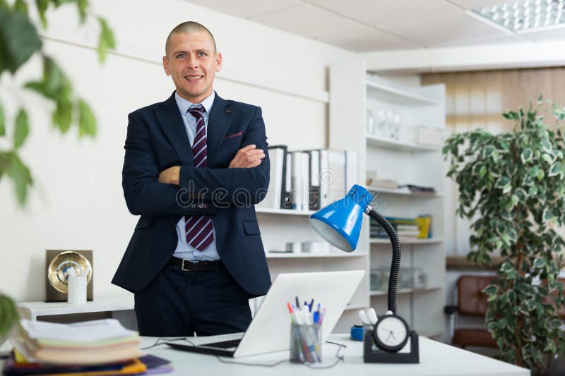 Office Worker Standing in Workplace and Looking in Camera Stock Photo ...