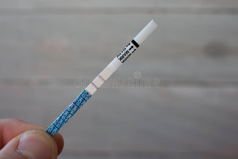 A Positive Pregnancy Test in the Male Hand Stock Photo - Image of ...