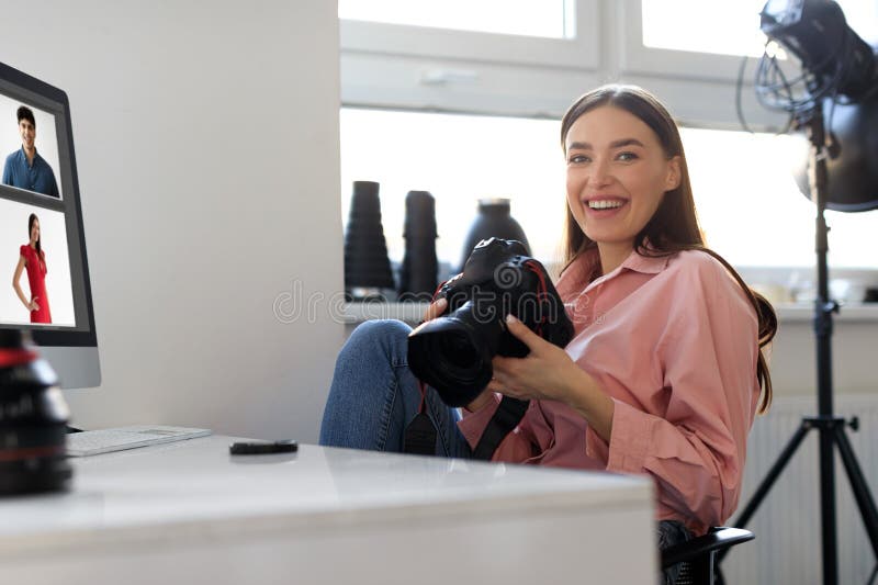 Positive Pretty Lady Photographer Working in Studio, Sitting at ...