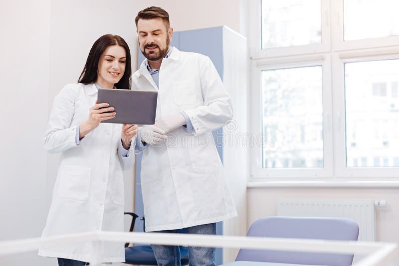 Positive Professional Doctors Working with a Tablet Stock Photo - Image ...