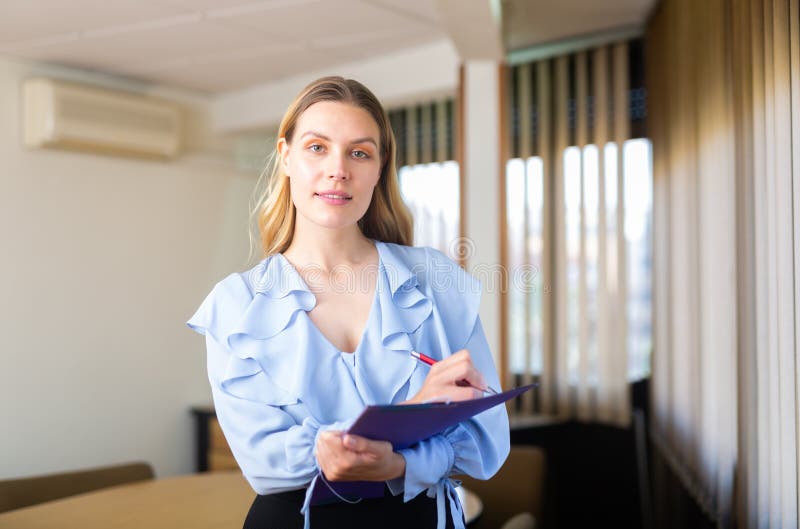 Positive Secretary with Folder for Documents in Office Stock Image ...