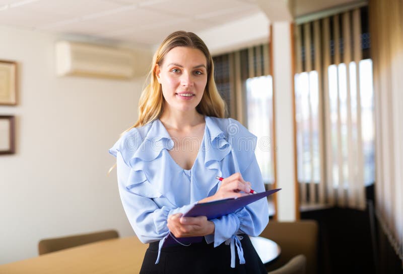 Positive Secretary with Folder for Documents in Office Stock Image ...