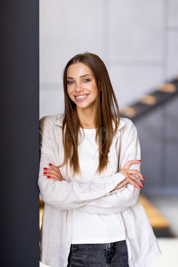 Positive Serious Woman Looking at Camera, Posing in Apartment Stock ...