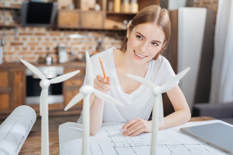 Positive Smiling Engineer Feeling Glad while Doing Her Favorite Work ...