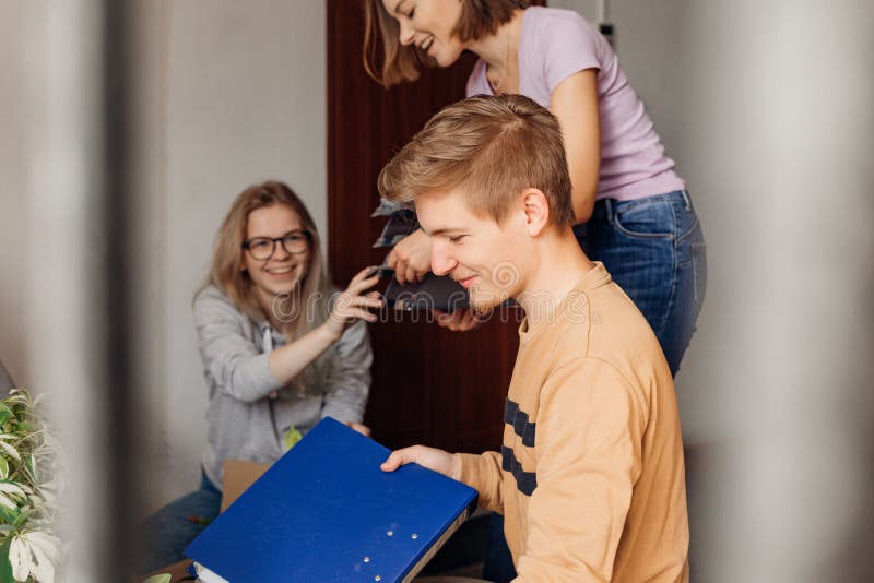 Positive, Smiling Students Preparing To Homework Project Presentation ...