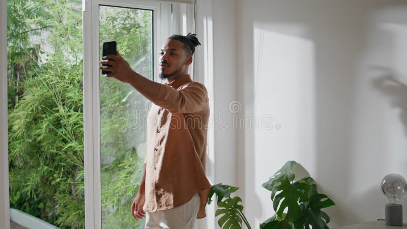 Positive Student Videocalling Mobile Home Office. Smart Guy Speaking ...