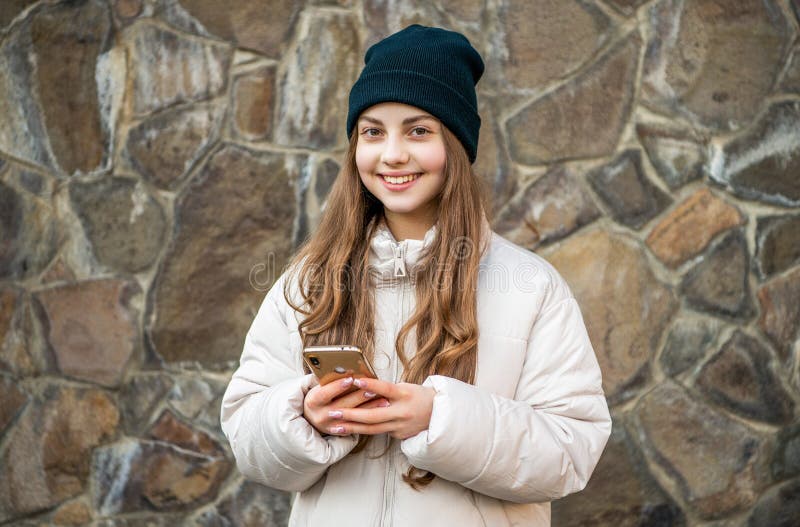 Positive Teen Girl Texting on Phone Outdoor. Teen Girl Texting on Phone ... Positive Teen Girl Texting on Phone Outdoor. Teen Girl Texting on Phone ...