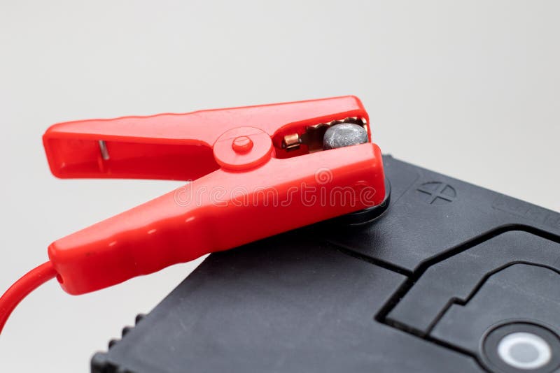 The Positive Terminal of the Car Battery. Charging Car Battery with ...