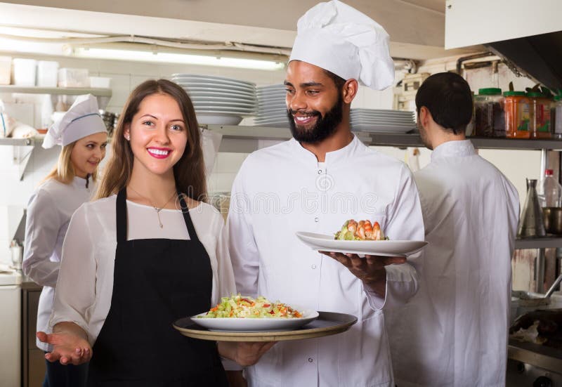 Positive Waitress Giving Payment Terminal To Business Guests in Stock ...