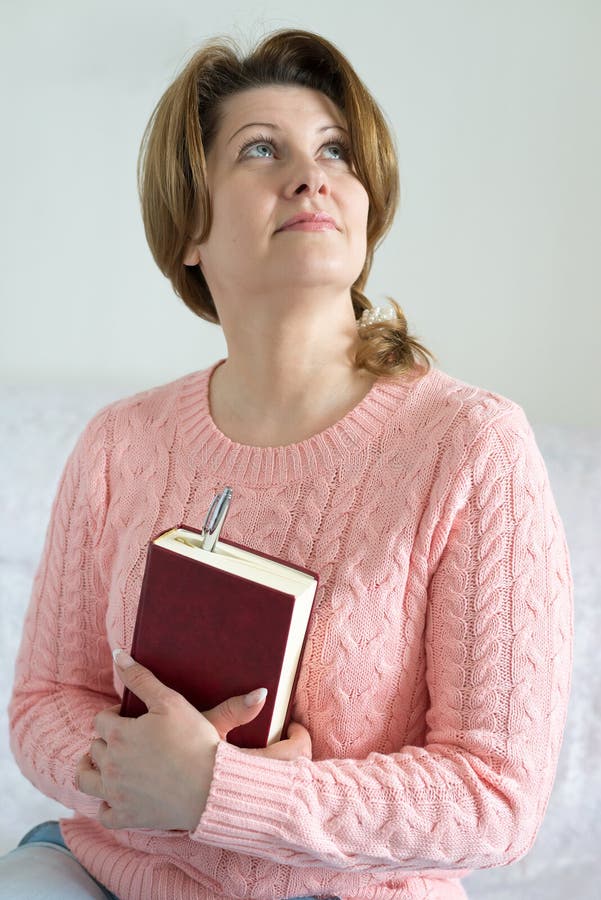 Positive Woman with a Notebook and Pen in Hand Stock Photo - Image of ...
