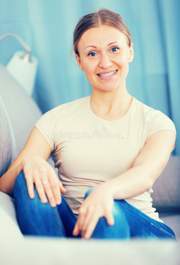 Positive Woman Relaxing on Sofa Stock Image - Image of graceful, long ...