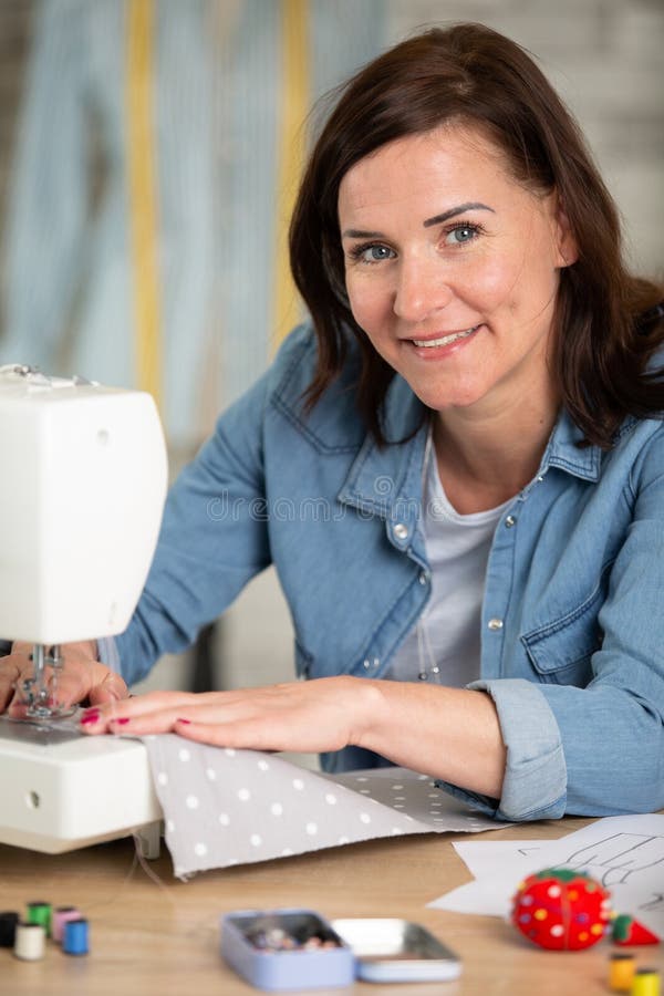 Positive Woman Sewing with Professional Machine at Workshop Stock Image ...