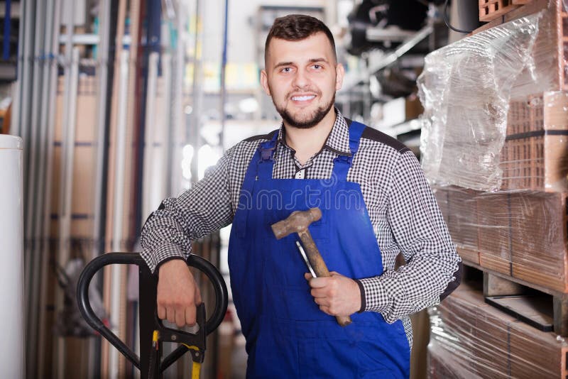 Positive Working Male Demonstrating Various Tools Stock Photo - Image ...