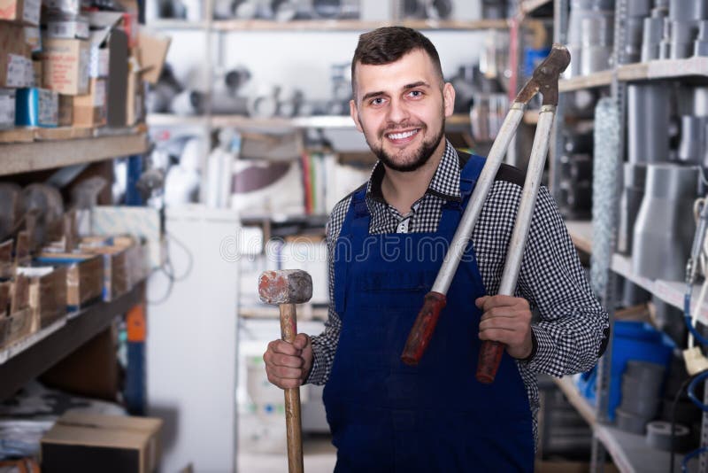 Positive Working Male Showing Various Tools Stock Photo - Image of ...