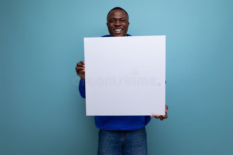 Positive Young African Man Presenting a Project on a White Sheet with a ...