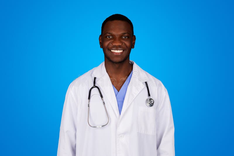 Positive Young Black Guy Doctor in White Coat Enjoy Work, Isolated on ...