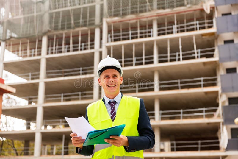 Positive Young Engineer Attentive Studies Work Documents Stock Photo ...