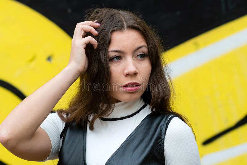 Pretty Young Girl Portrait on Blurred Wall Sprayed with Graffiti Stock ...