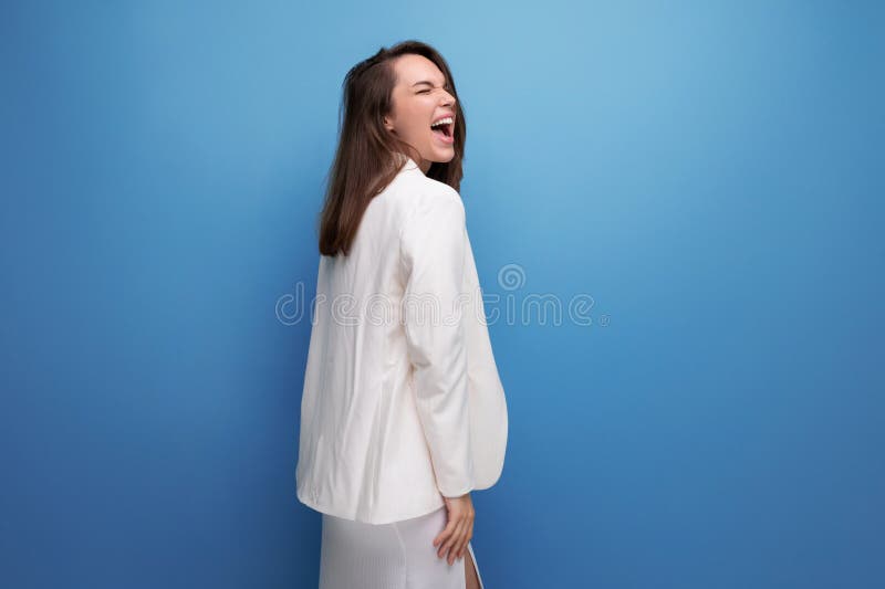 Positive Young Lady with Dark Hair Below Her Shoulders in a White Dress ... Positive Young Lady with Dark Hair Below Her Shoulders in a White Dress ...