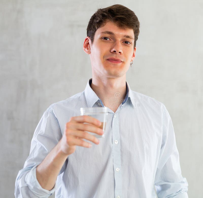 Positive Young Man Drinking Water from Glass Stock Image - Image of ...
