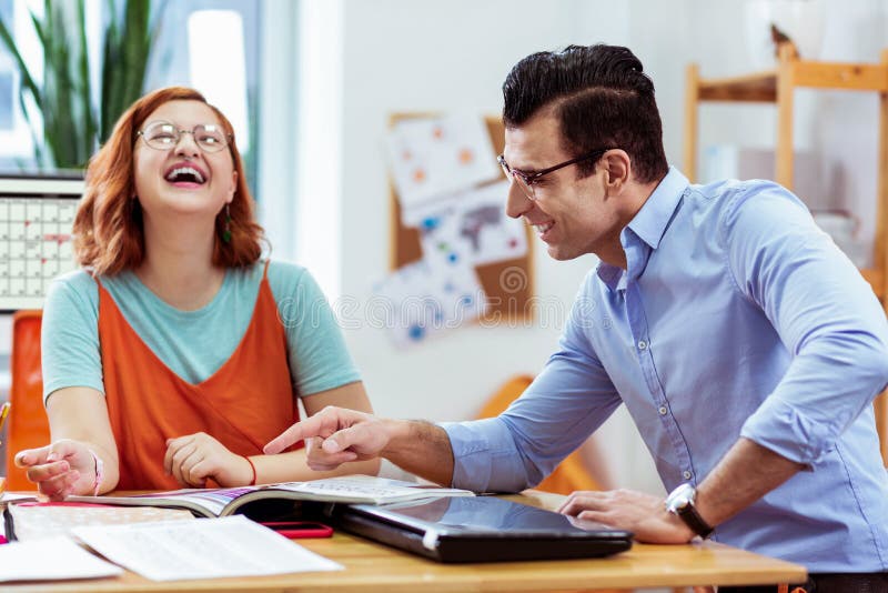 Positive Young Man Pointing at the Book Stock Photo - Image of degree ...