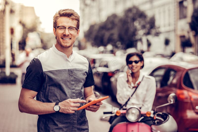 Positive Young Man Standing with a Tablet Stock Image - Image of ...