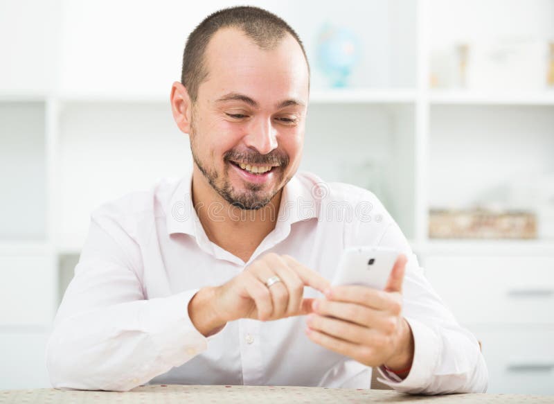 Positive Young Man with Smartphone Stock Photo - Image of holding ...