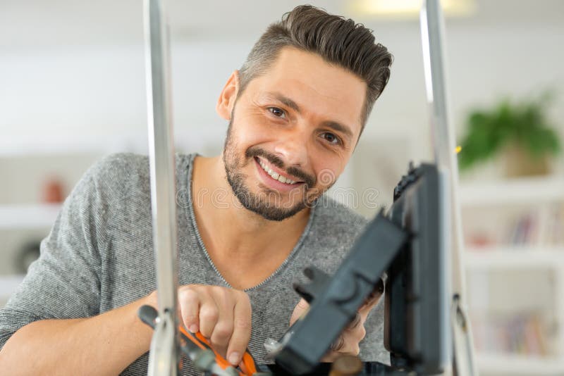 Positive Young Man with Tools Stock Photo - Image of tool, screwdriver ...