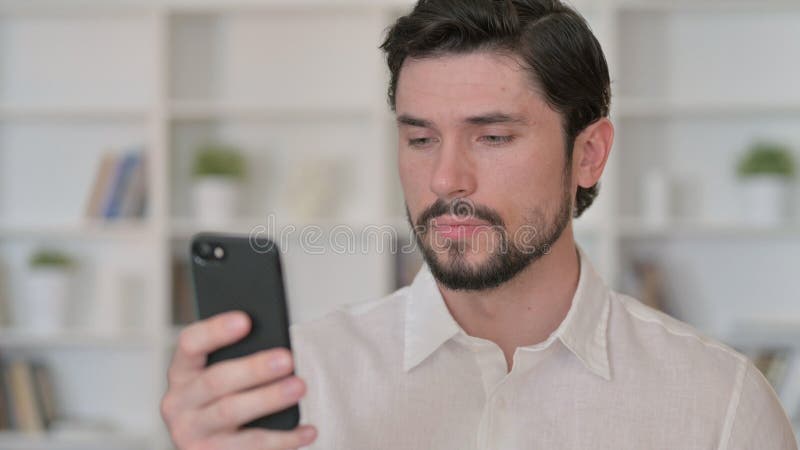 Positive Young Man Using Smartphone Stock Photo - Image of internet ...