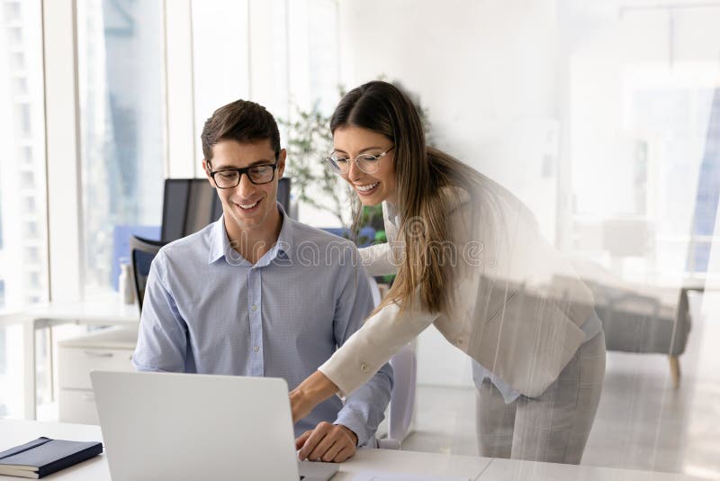 Positive Young Mentor Explaining Intern How Professional Application ...