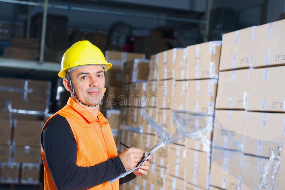 Positive Young Storekeeper at Work in Warehouse Stock Image - Image of ...