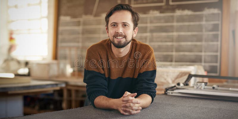 Positve Young Designer Leaning on Table in His Studio Stock Image ...
