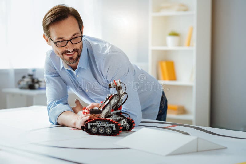 Possitive Professional Engineer Testing Robot in a Lab Stock Photo ...