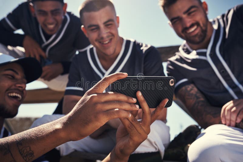The Post Game Analysis. a Group of Young Men Using a Smartphone after ...