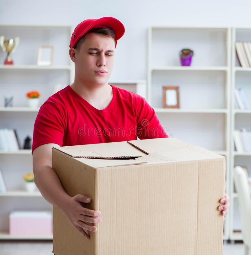 Post Man Delivering a Parcel Package Stock Photo - Image of heavy ...