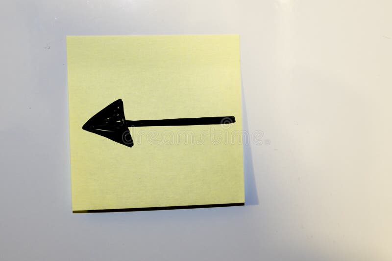 Post-it Note with an Arrow Written in Black Stock Image - Image of ...