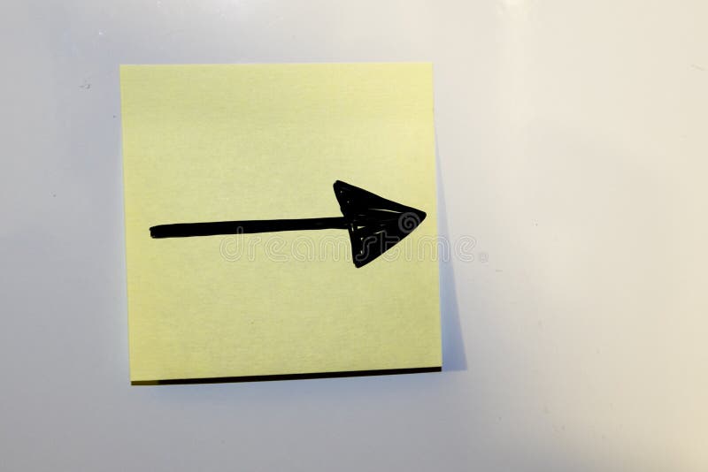 Post-it Note with an Arrow Written in Black Stock Image - Image of ...